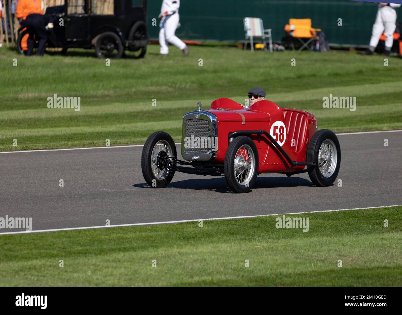 A red Austin Seven sports racing car at the 2022 Goodwood Revival Stock ...
