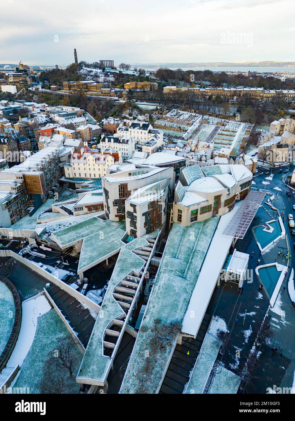 Aerial view of winter snow covered roofs of Scottish Parliament ...