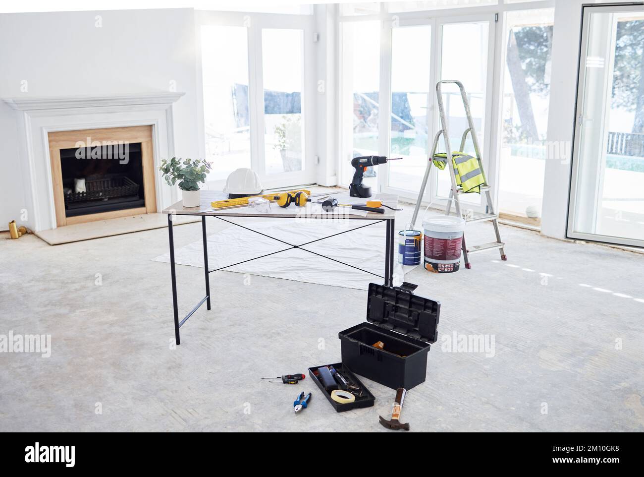 An architects workspace. building plans and equipment on a table in an ...