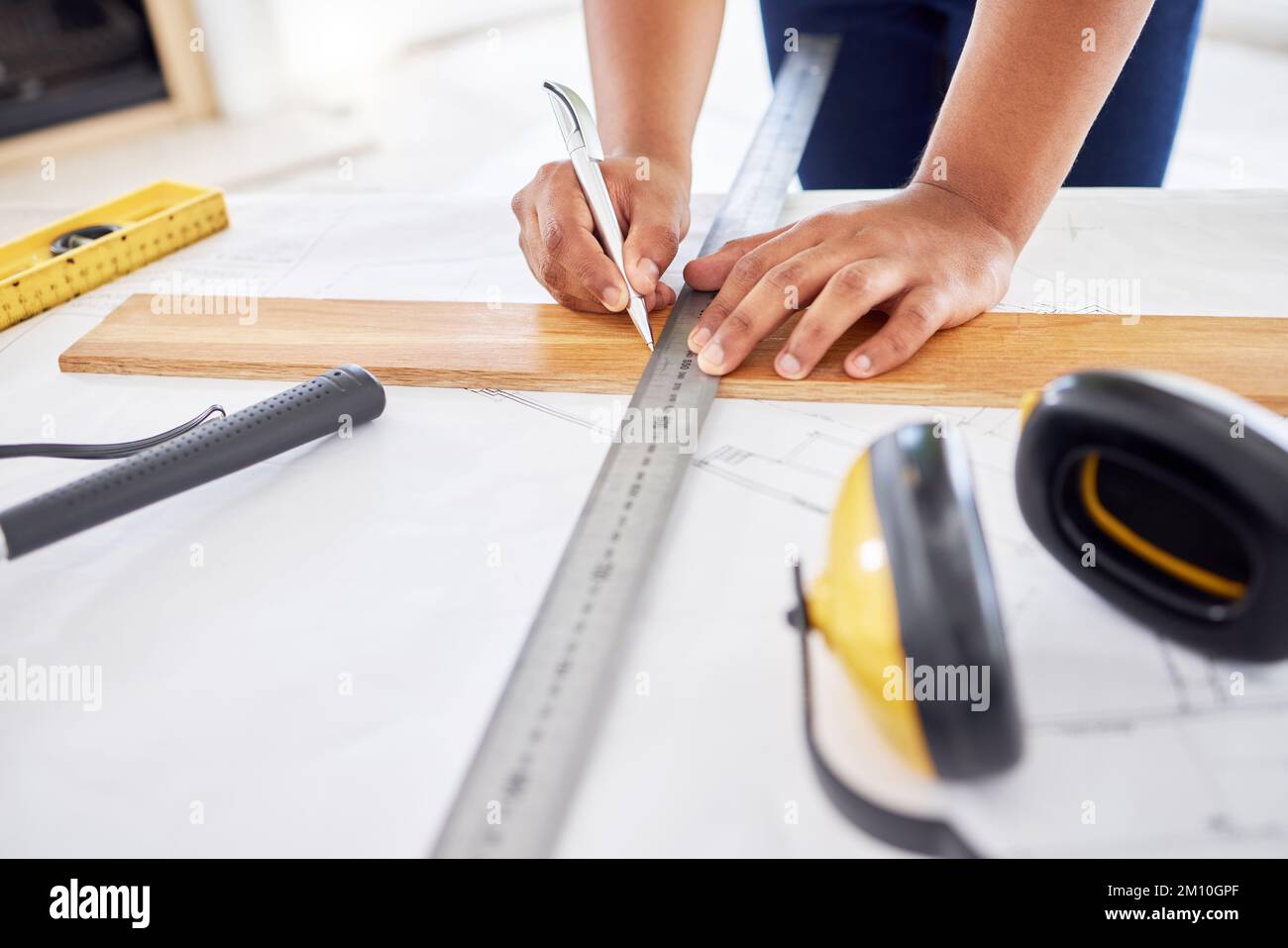 Builder using measure ruler writing hi-res stock photography and images ...