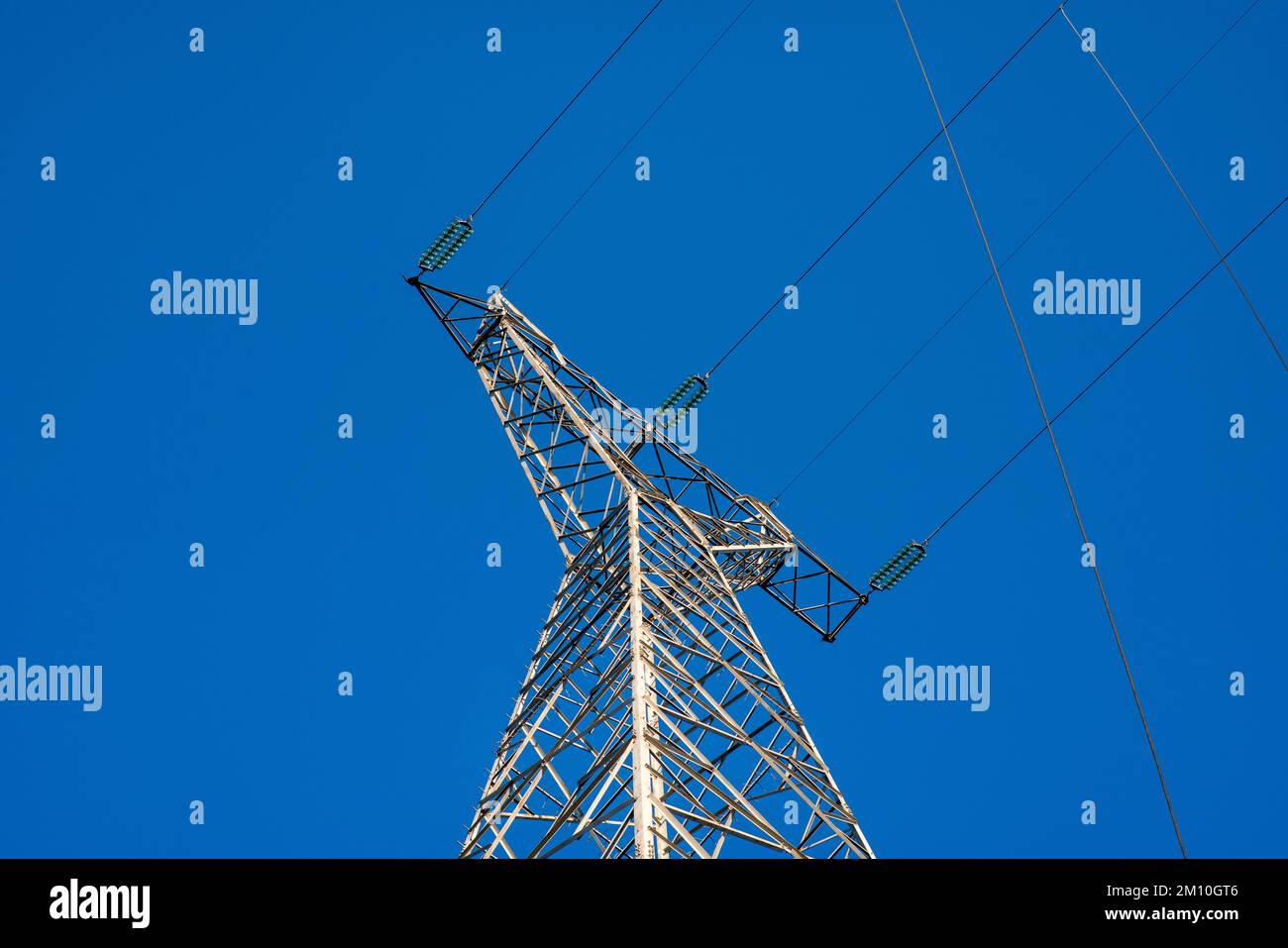 high voltage electricity pylon, with electric cables from the starting ...