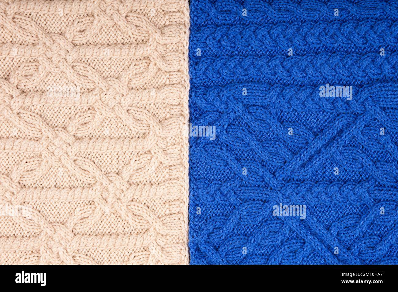 Knitted blue and beige background. Large knitted fabric with a pattern ...