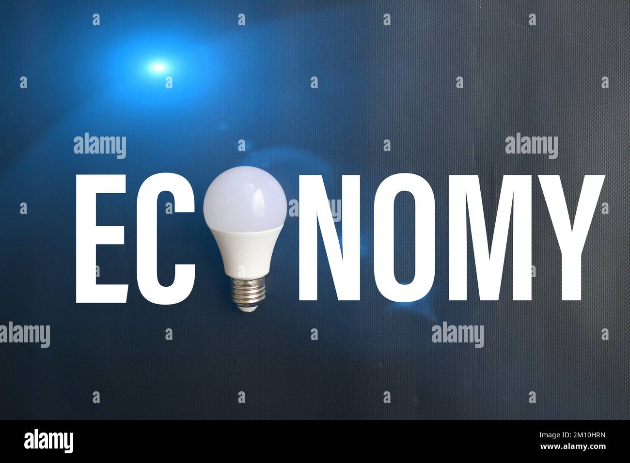 Economy lettering created from led bulb on colored background. Creative ...