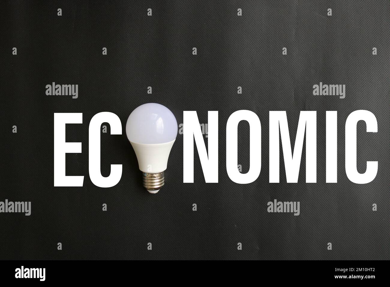 Economy lettering created from led bulb on colored background. Creative ...