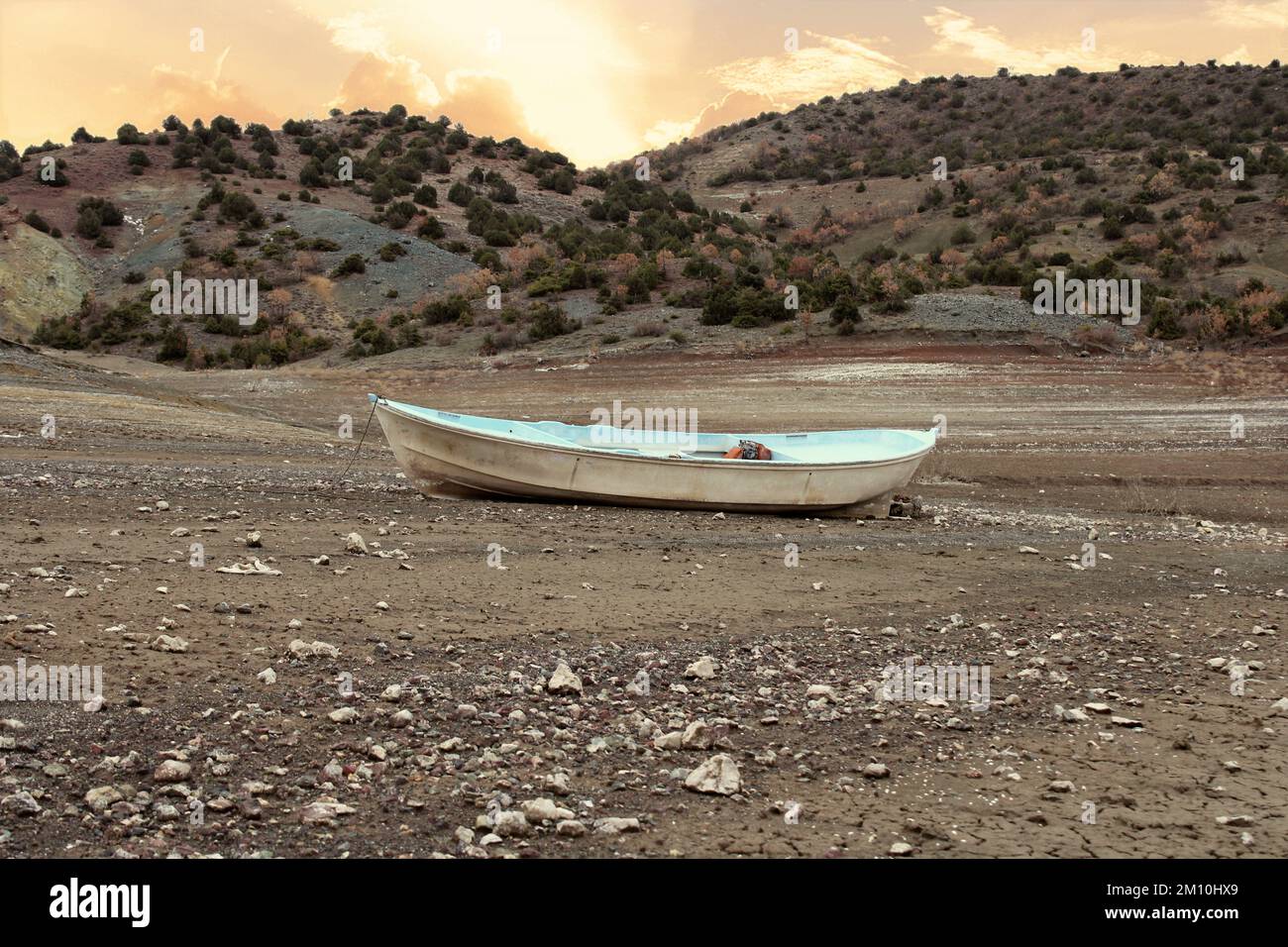 White small boat that remained above the ground as the lake dried up ...