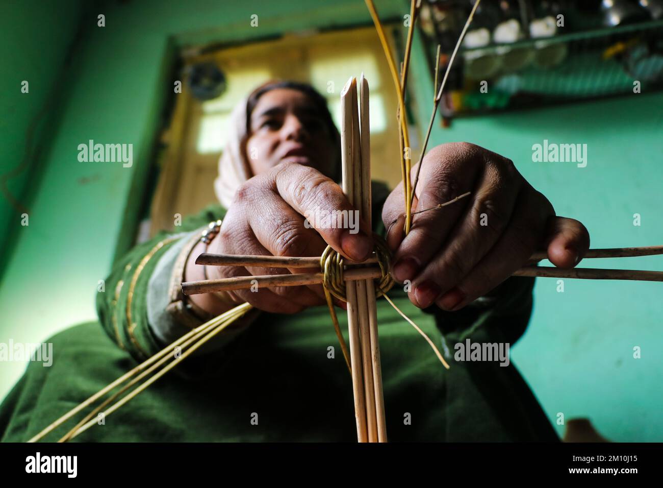 December 9, 2022, Budgam, Jammu and Kashmir, India: Mubeena makes a ...