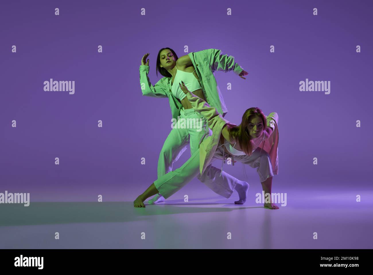 Experimental dance. Two young girl in motion, action isolated over ...