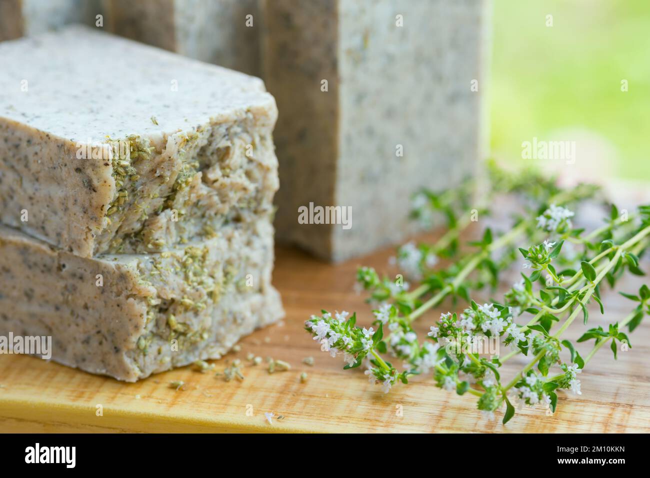 Green handmade scrub soap closeup with wormwood and thyme Stock Photo ...