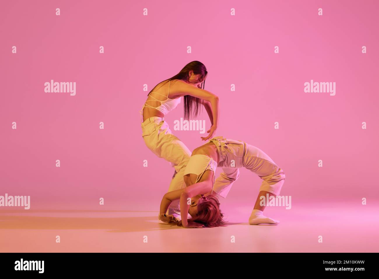 Modern dance art. Young girls, couple of dancers in sports style ...