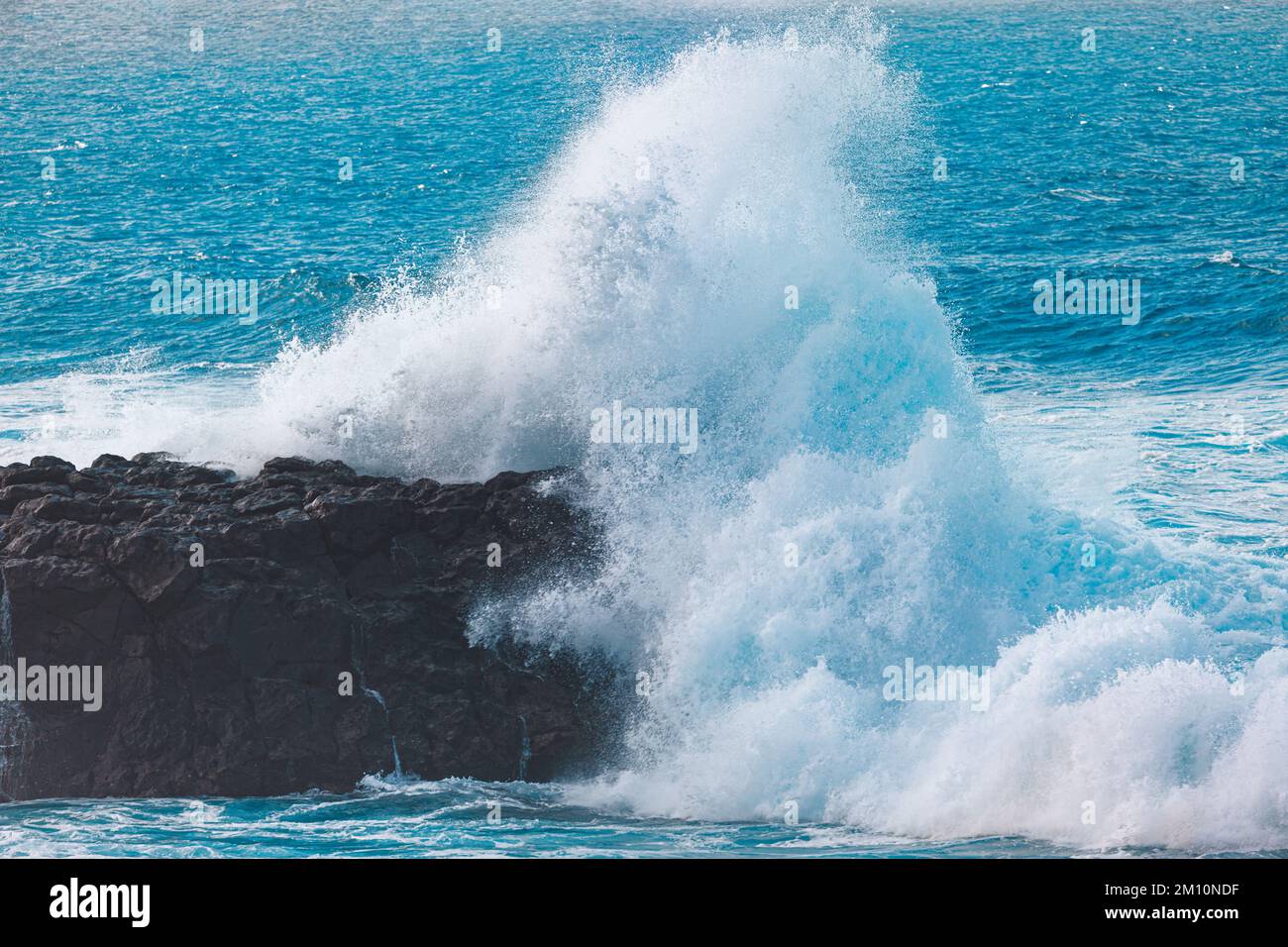 Big wave beating the rock . Cliff breaking the ocean wave . Power of ...