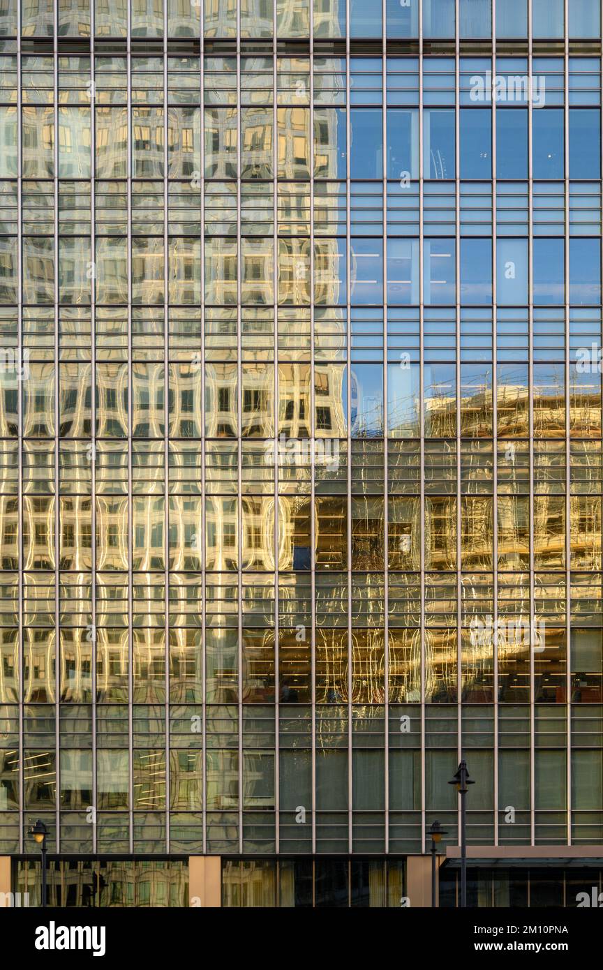 Modern office skyscraper buildings reflected in glass office windows at ...