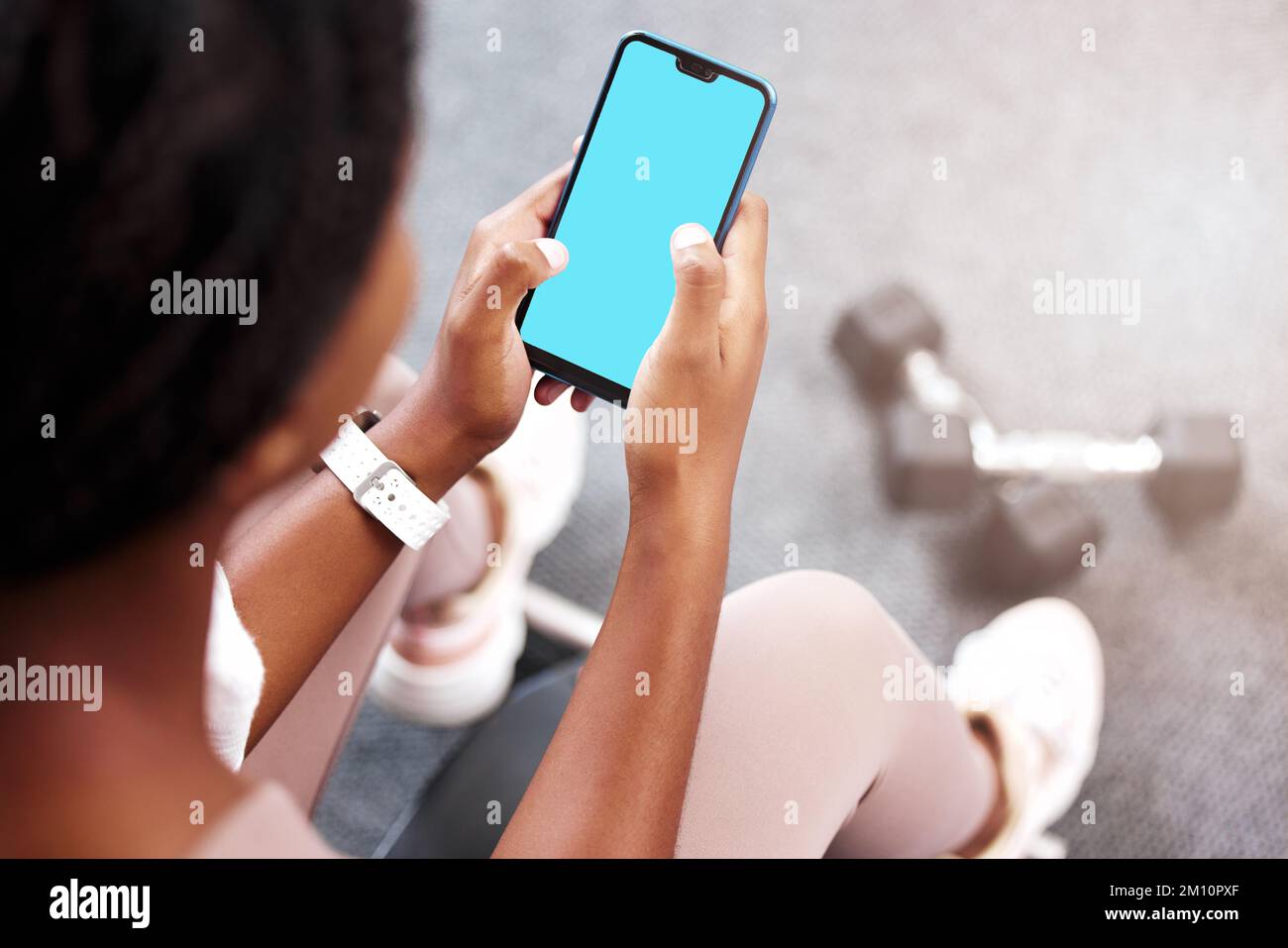 Fitness, smartphone in hands and mockup with green screen, black woman ...