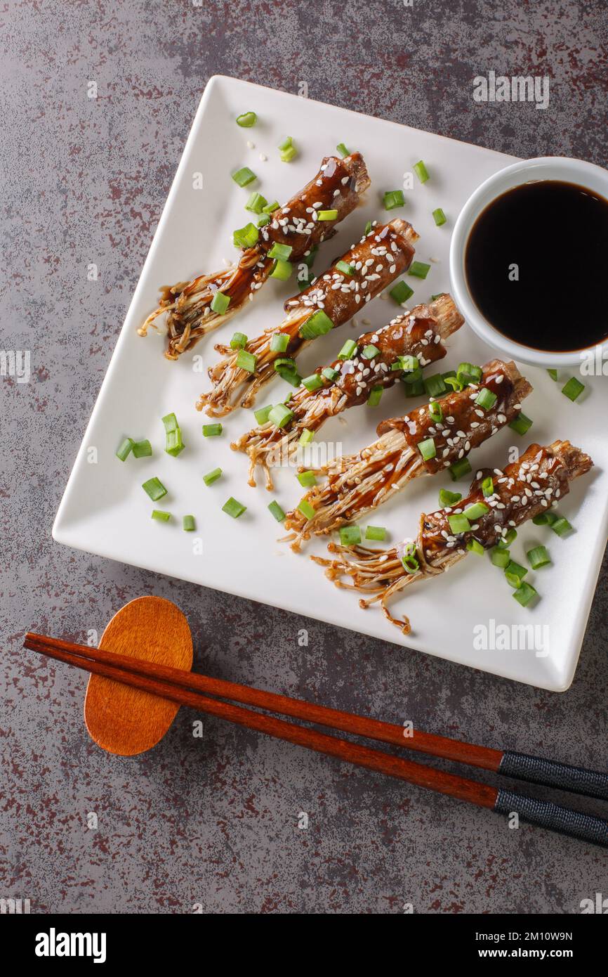 Japanese Food Steak Rolls Stuffed with Enoki Mushrooms close-up in a ...