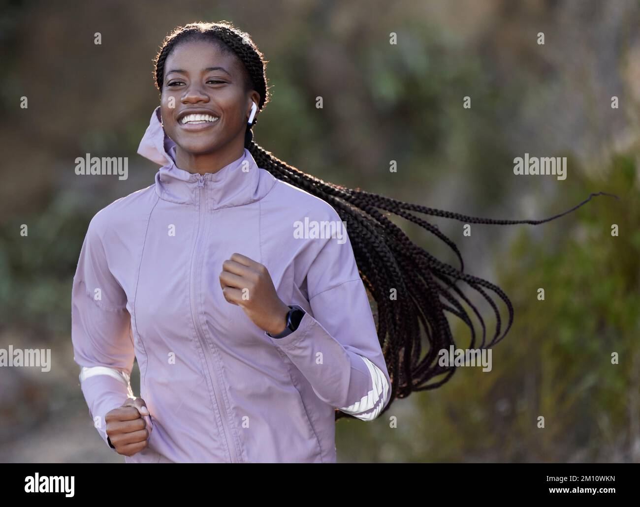 Black woman running headphones hi-res stock photography and images - Alamy