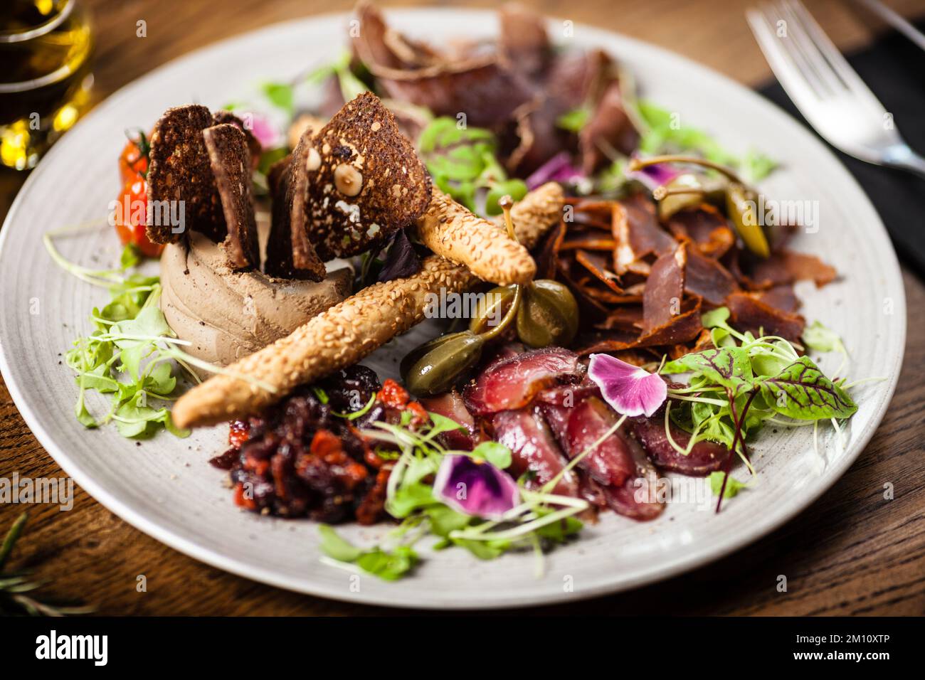 Meat platter for two: Dry-aged beef brisket, duck fillet, beef liver ...