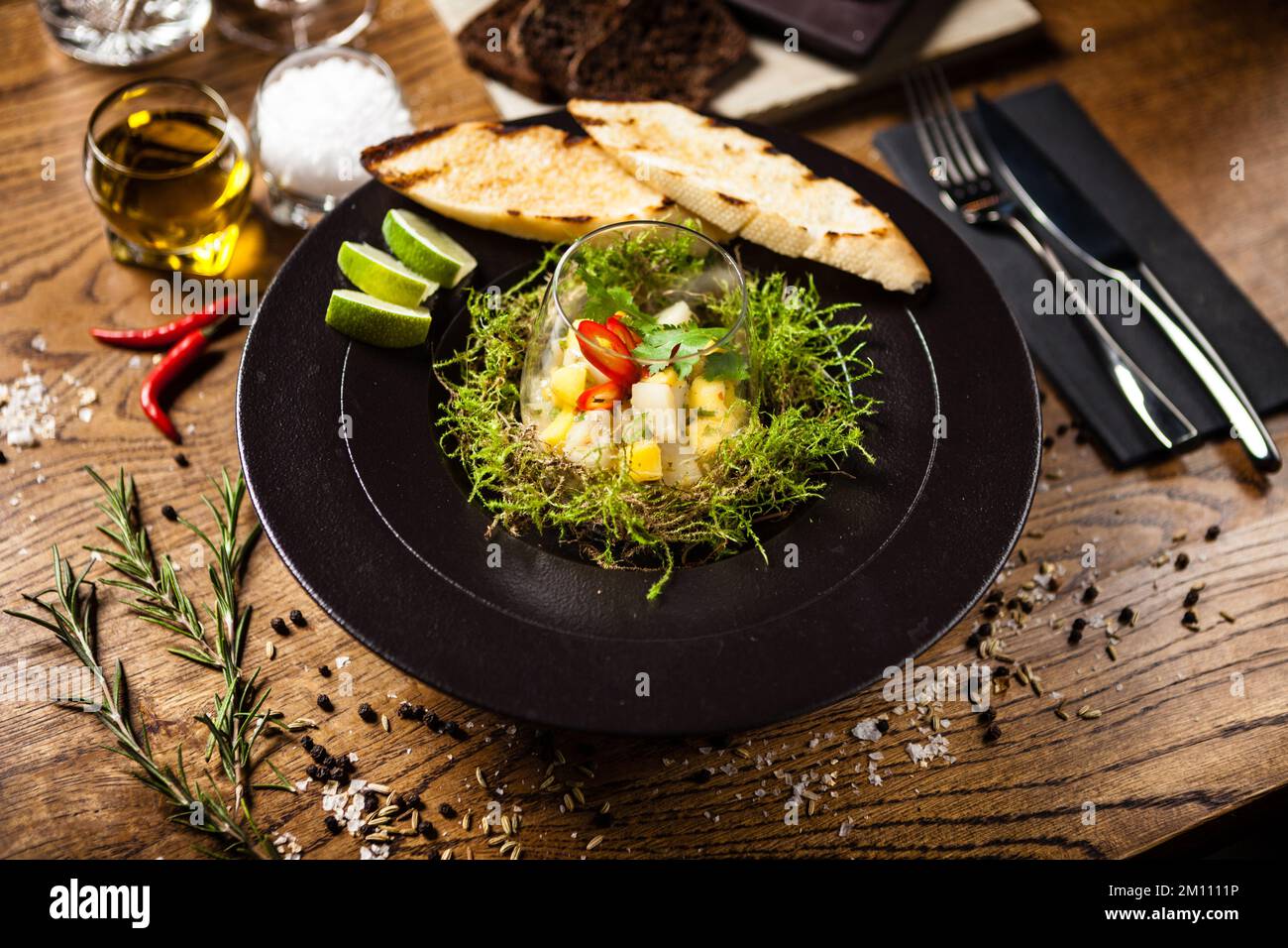 Scallop ceviche with mango, chilli and cilantro served with liquid ice ...