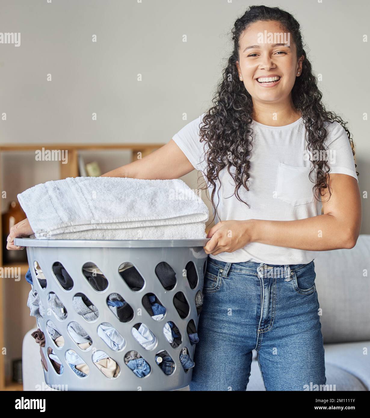 Woman, portrait and laundry basket for cleaning and folding of clothing ...