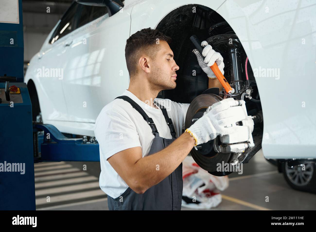 Male removing old wheel hi-res stock photography and images - Alamy