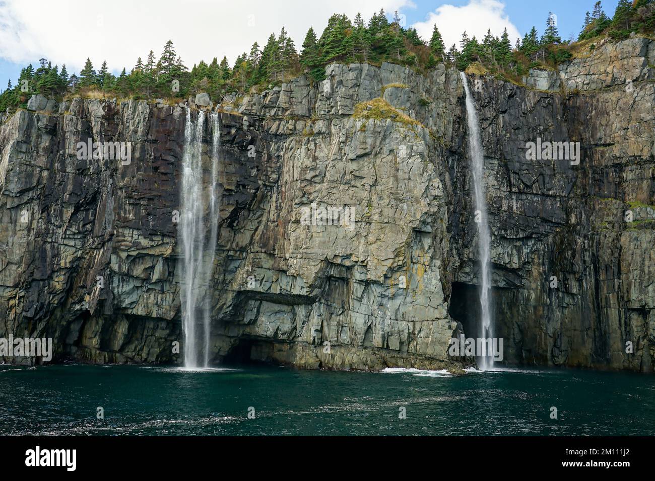 Two tall waterfalls coming from a cliff in Newfoundland, Canada Stock ...