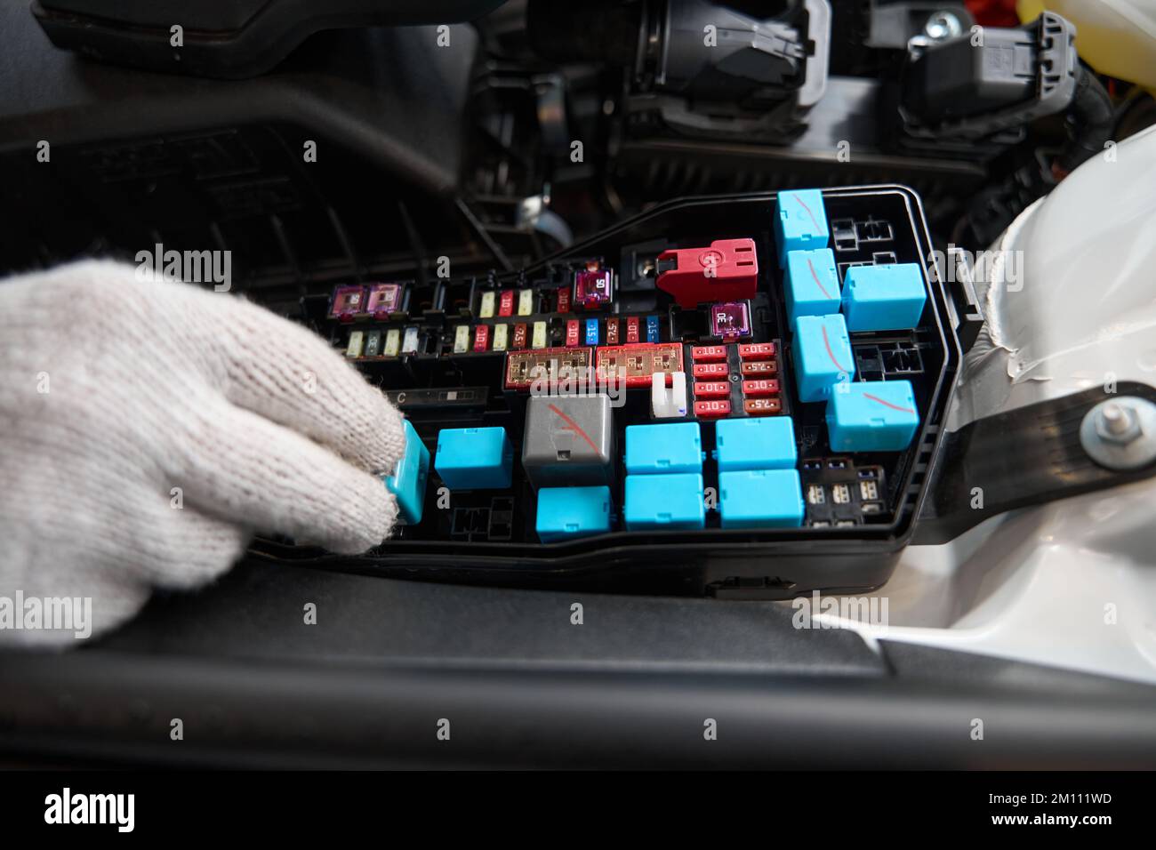 Close up photo of technician checking parts of automobile Stock Photo ...
