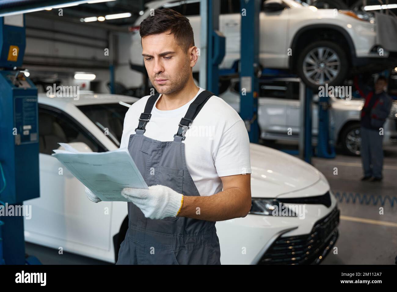 Man engineer checking documents hi-res stock photography and images - Alamy