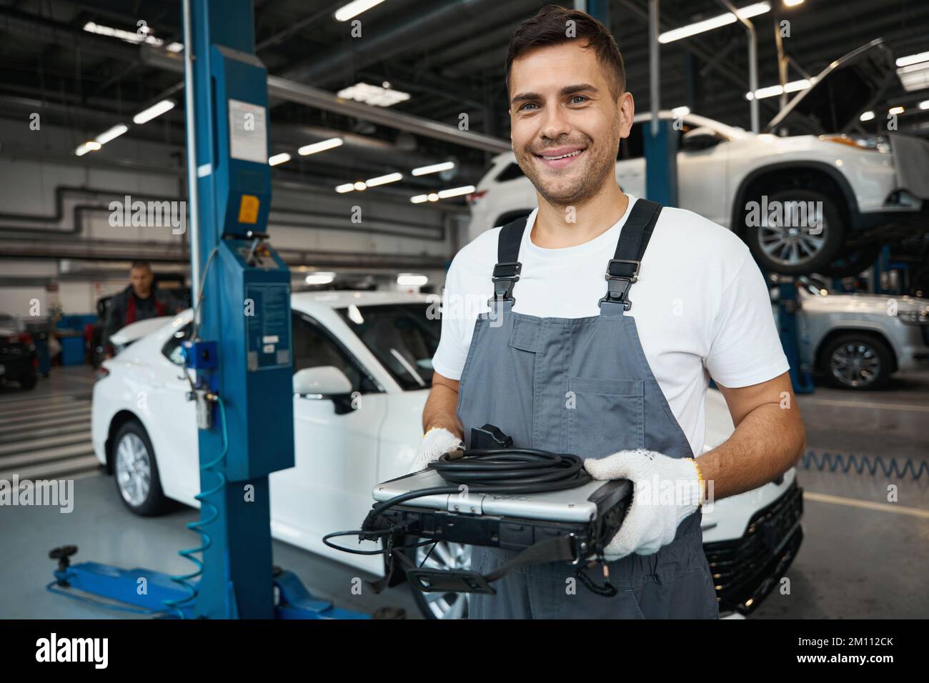 Mechanic is holding instruments, ready for work Stock Photo - Alamy