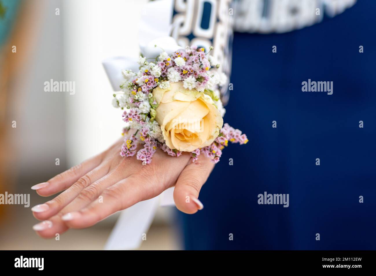 small bouquet with yellow rose and colorful microflowers Stock Photo ...