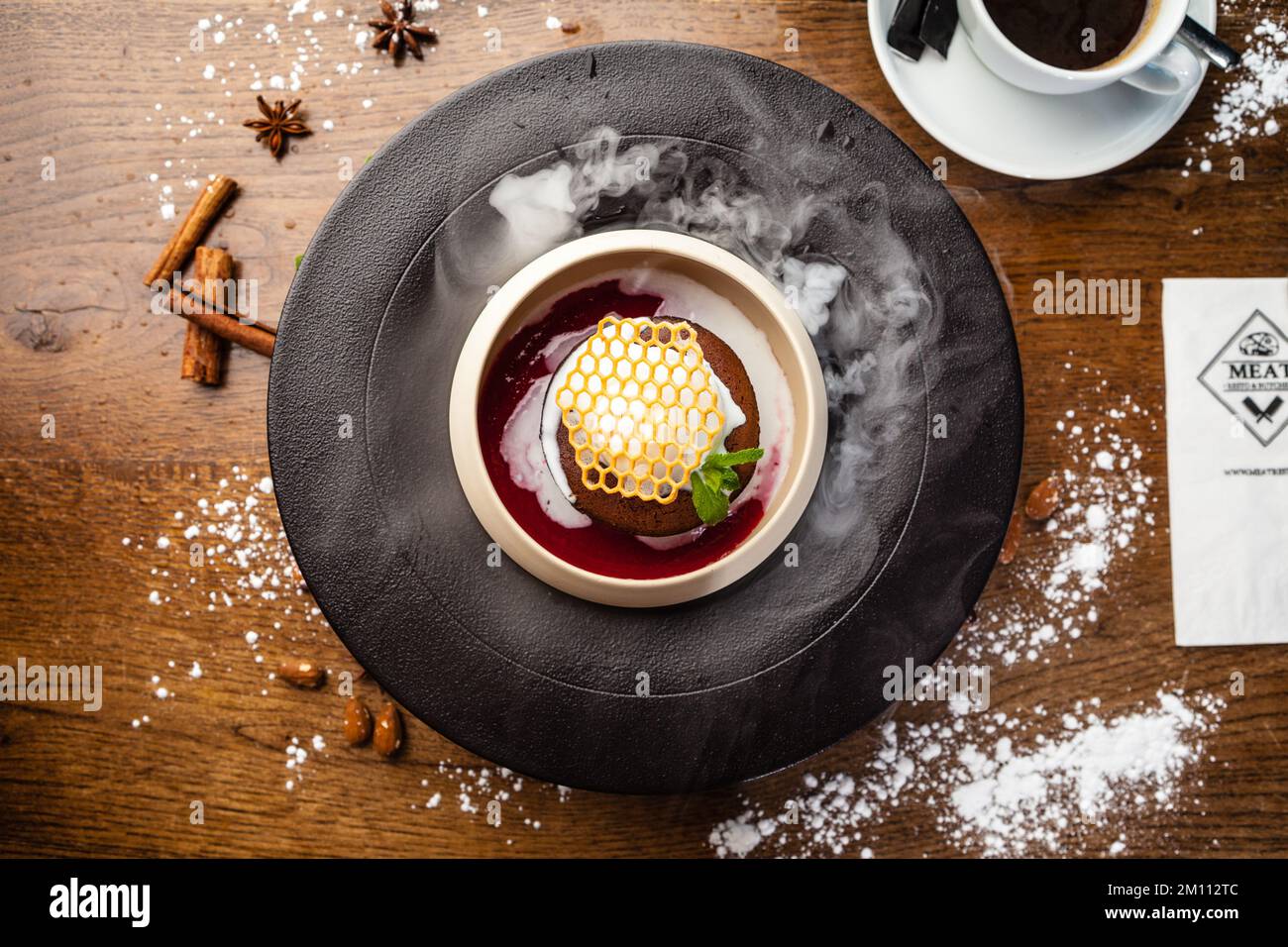 Chocolate fondant. Dark chocolate, raspberry sauce, vanilla ice cream ...
