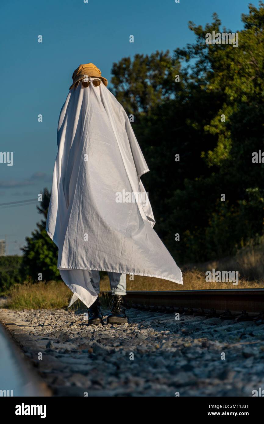 A ghost standing on the railway tracks in the countryside Stock Photo ...