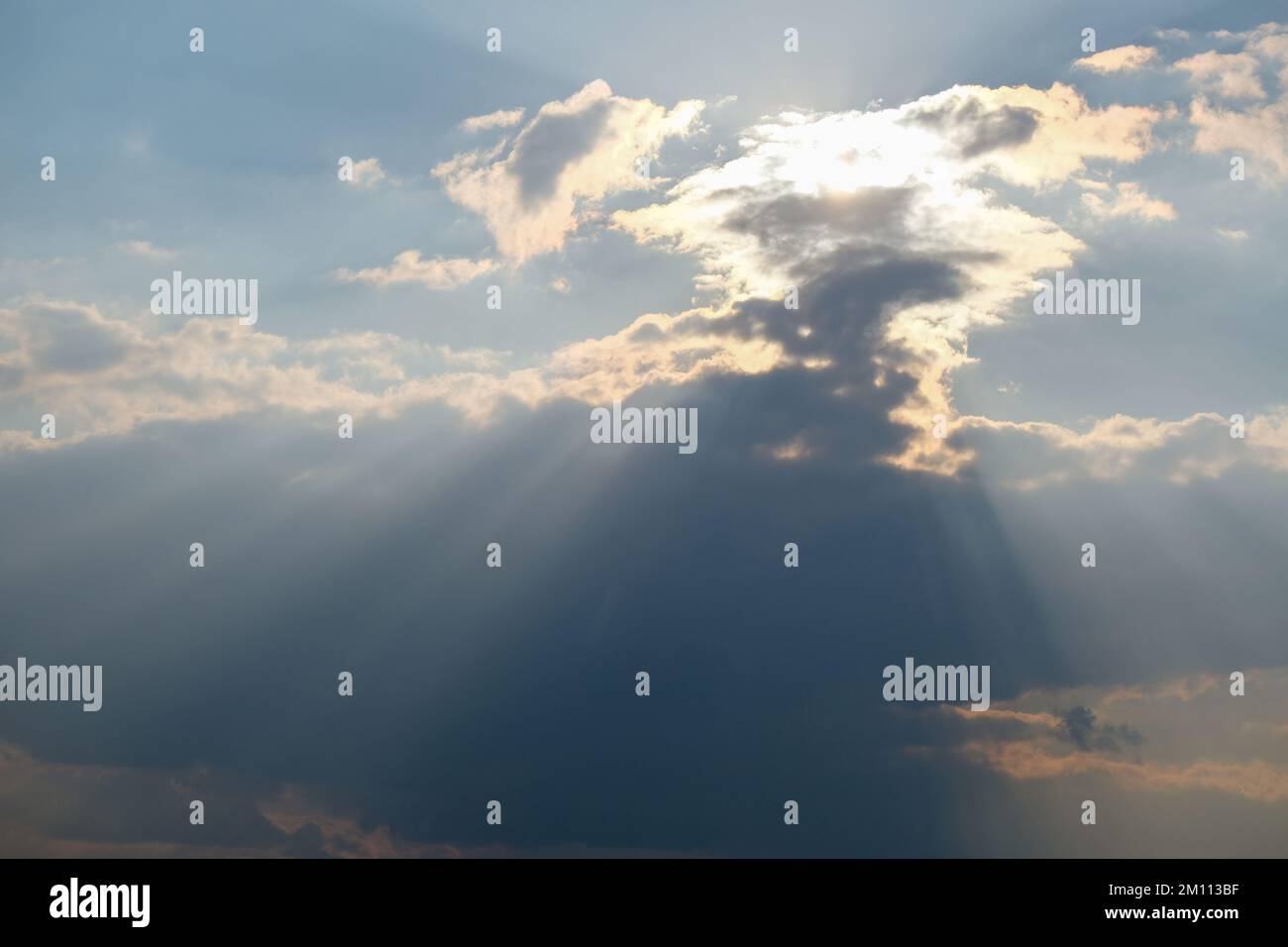 Sunlight streaks blue sky hi-res stock photography and images - Alamy