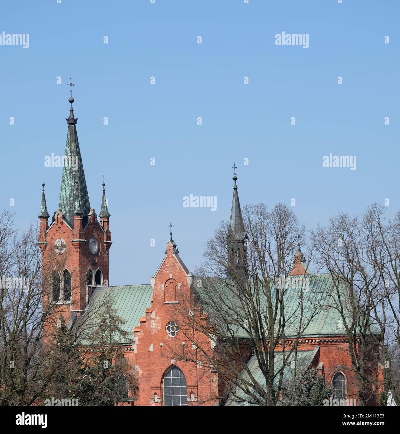 The top of the church - soaring towers of a brick church Stock Photo ...