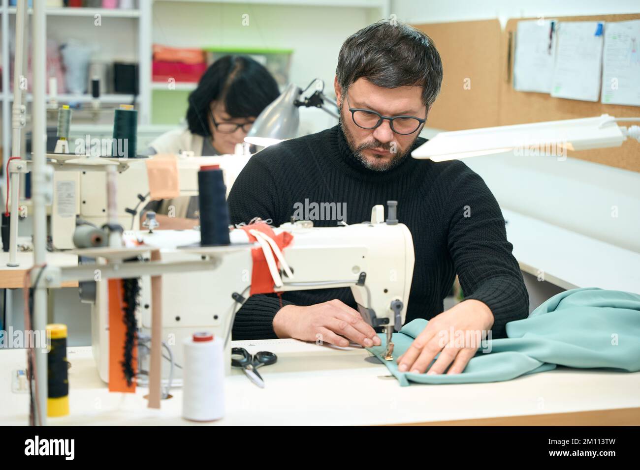 Focused male tailor working hi-res stock photography and images - Alamy