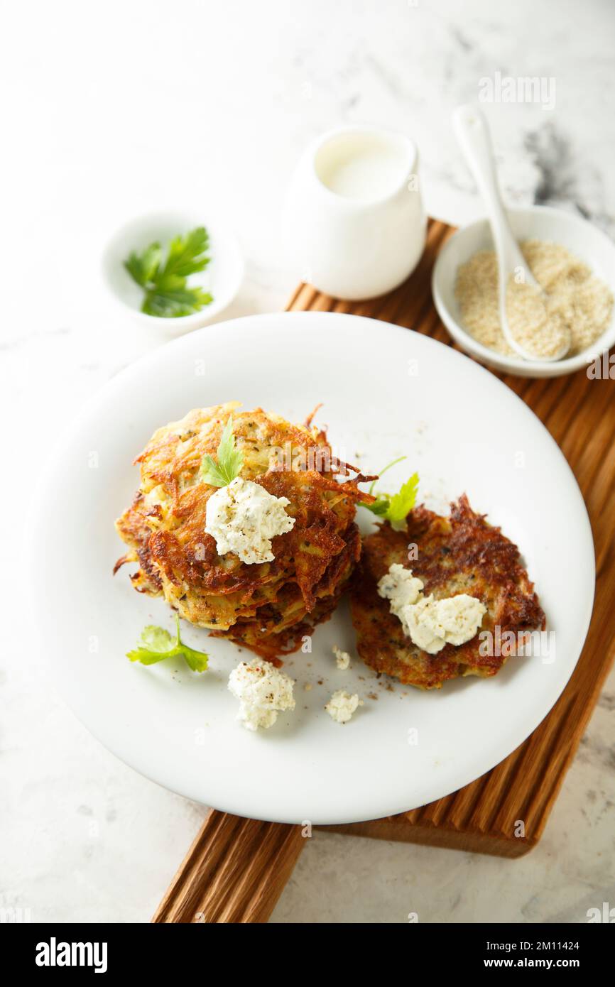 Homemade potato latkes with cream cheese Stock Photo - Alamy