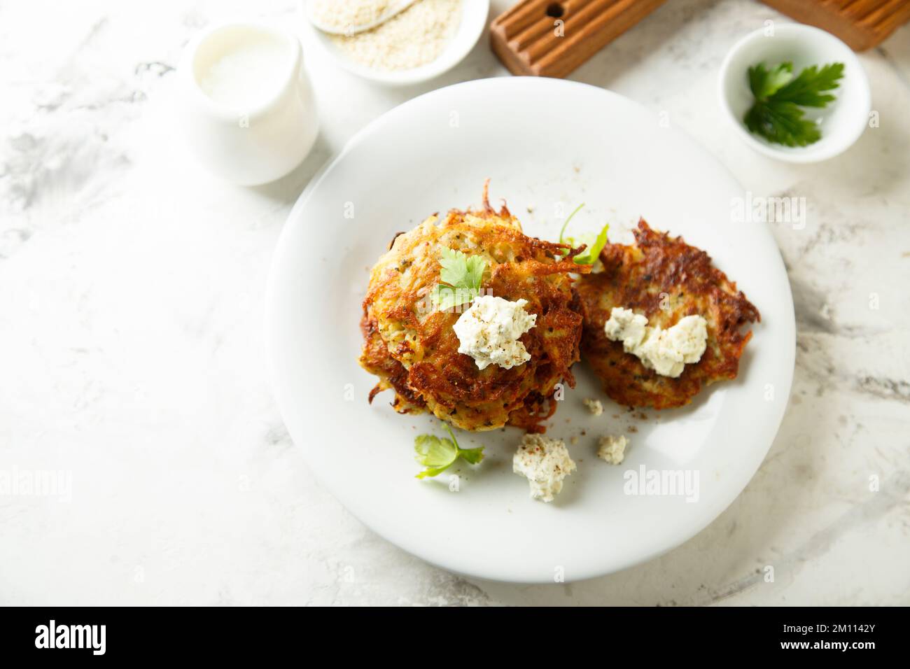 Homemade potato latkes with cream cheese Stock Photo - Alamy