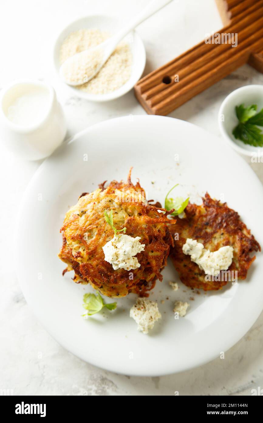 Homemade potato latkes with cream cheese Stock Photo - Alamy