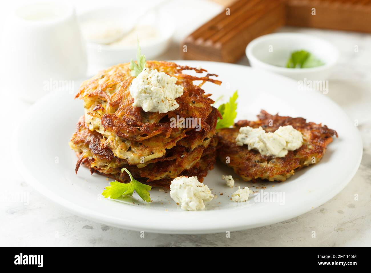 Homemade potato latkes with cream cheese Stock Photo - Alamy