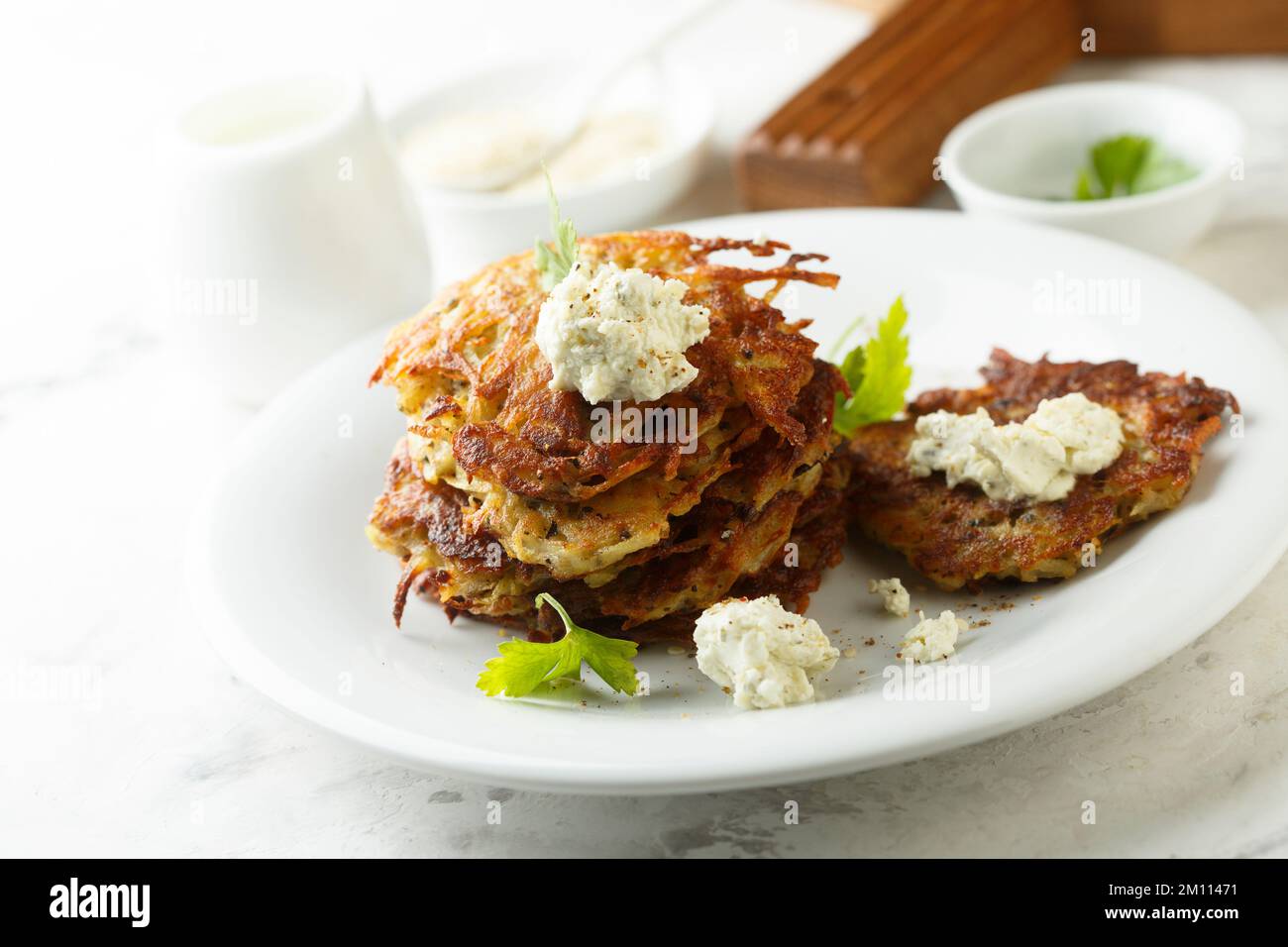 Homemade potato latkes with cream cheese Stock Photo - Alamy