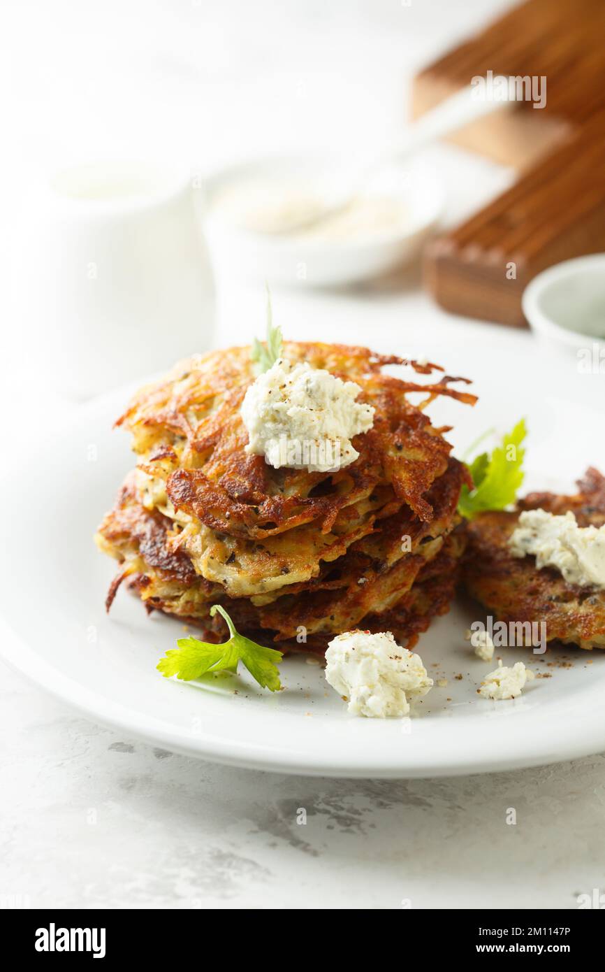 Homemade potato latkes with cream cheese Stock Photo - Alamy