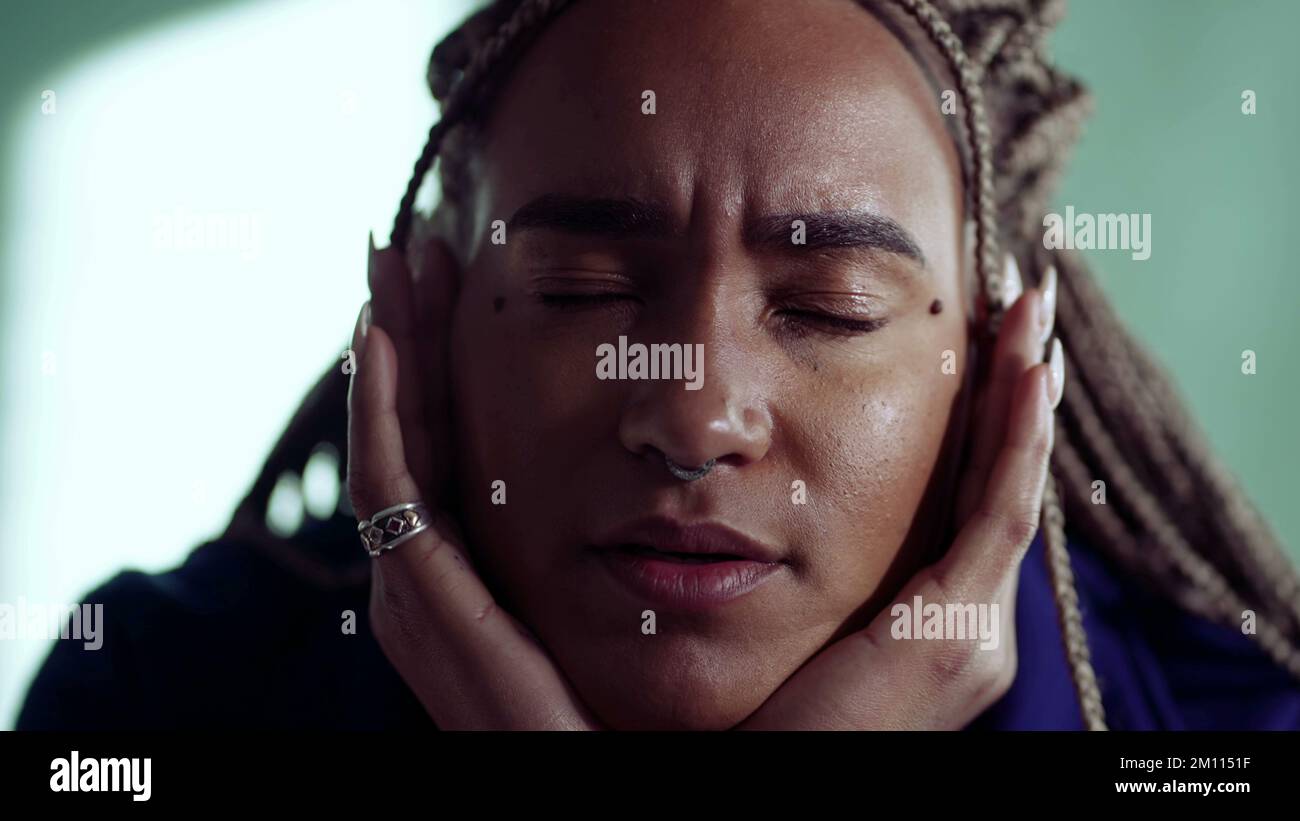 Stressed young woman closeup face eyes closed. Exhausted African ...