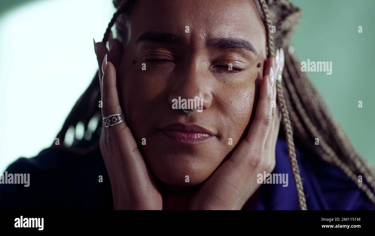 Stressed young woman closeup face eyes closed. Exhausted African ...