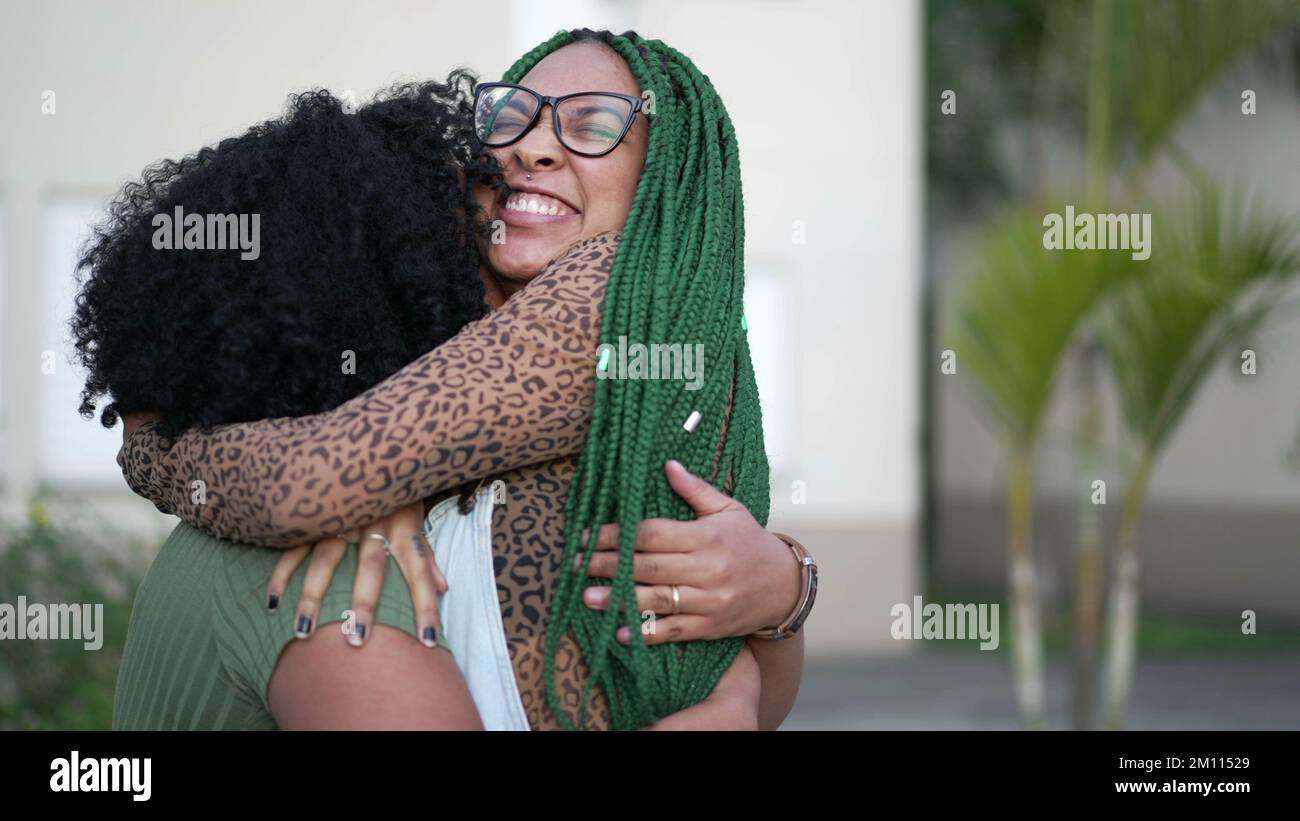 Black people hugging reunion reunion hi-res stock photography and ...