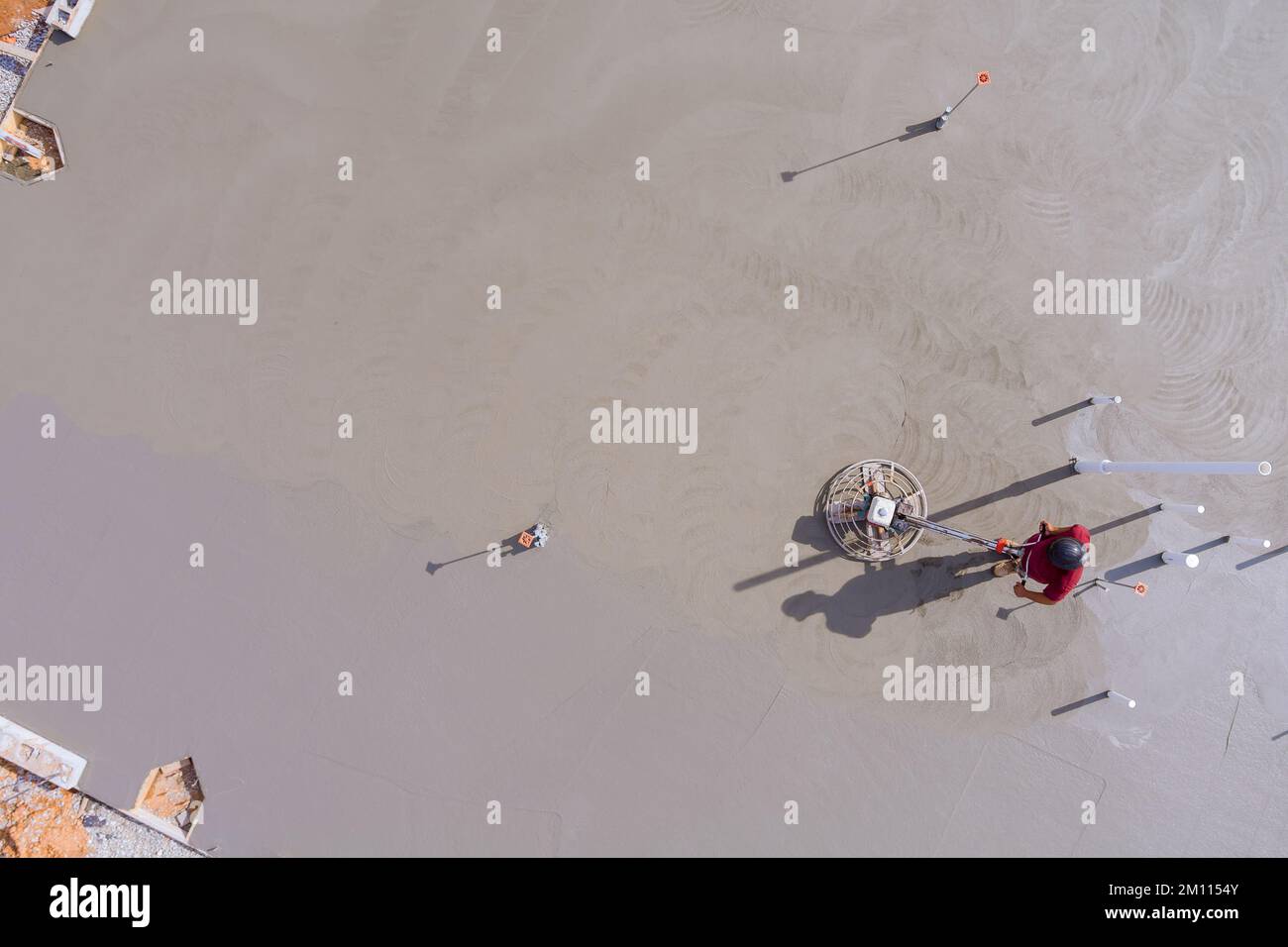 An operation to polish and level cement screed mortar floor on ...