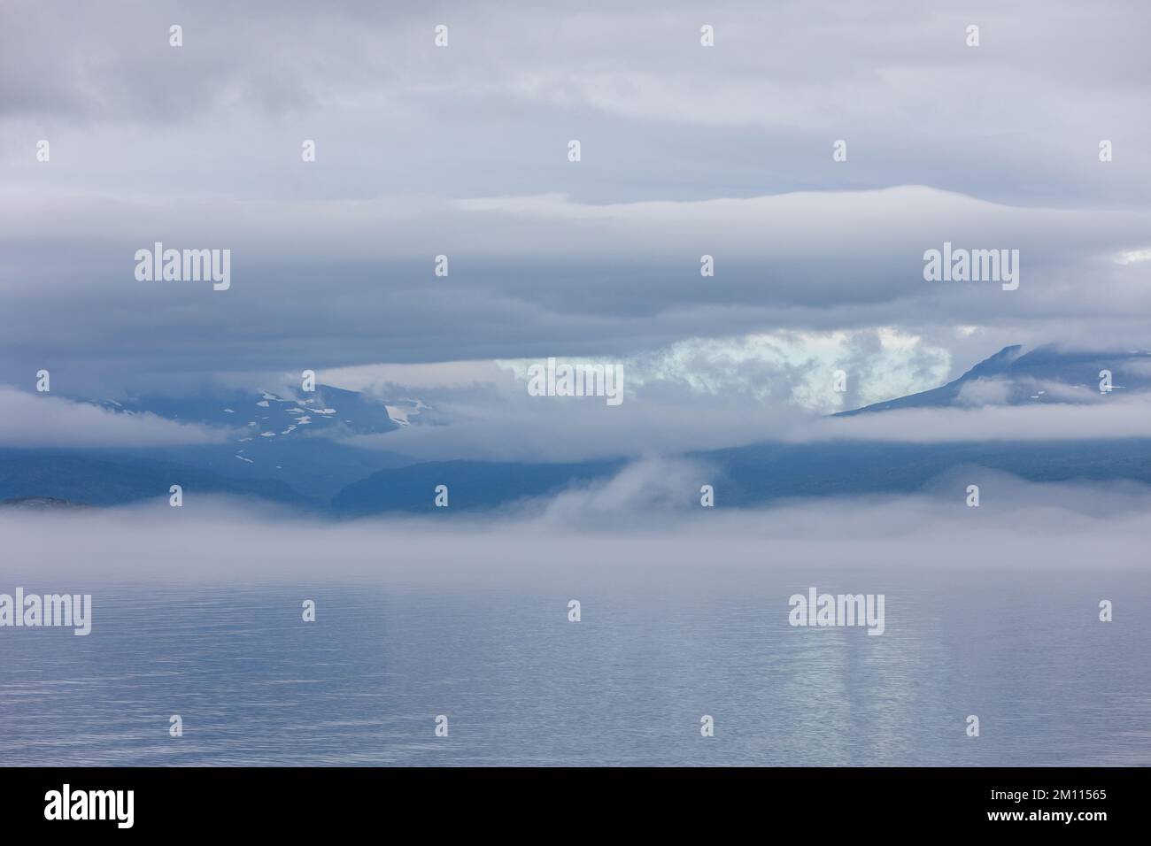 A minimalistic view of the fluffy white clouds over the calm sea Stock ...