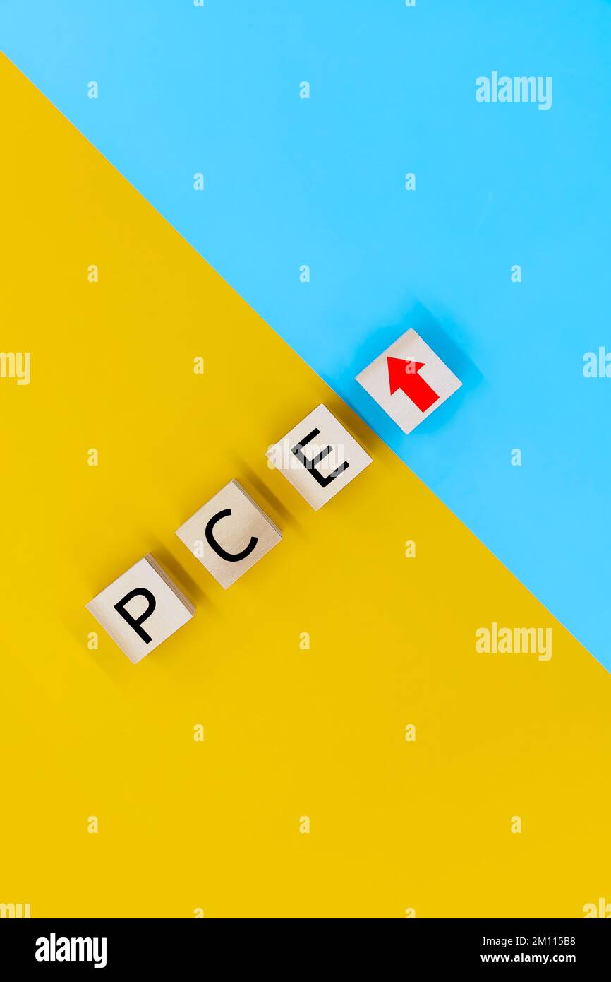 pce, personal consumption expenditure symbol. Wooden blocks with words ...