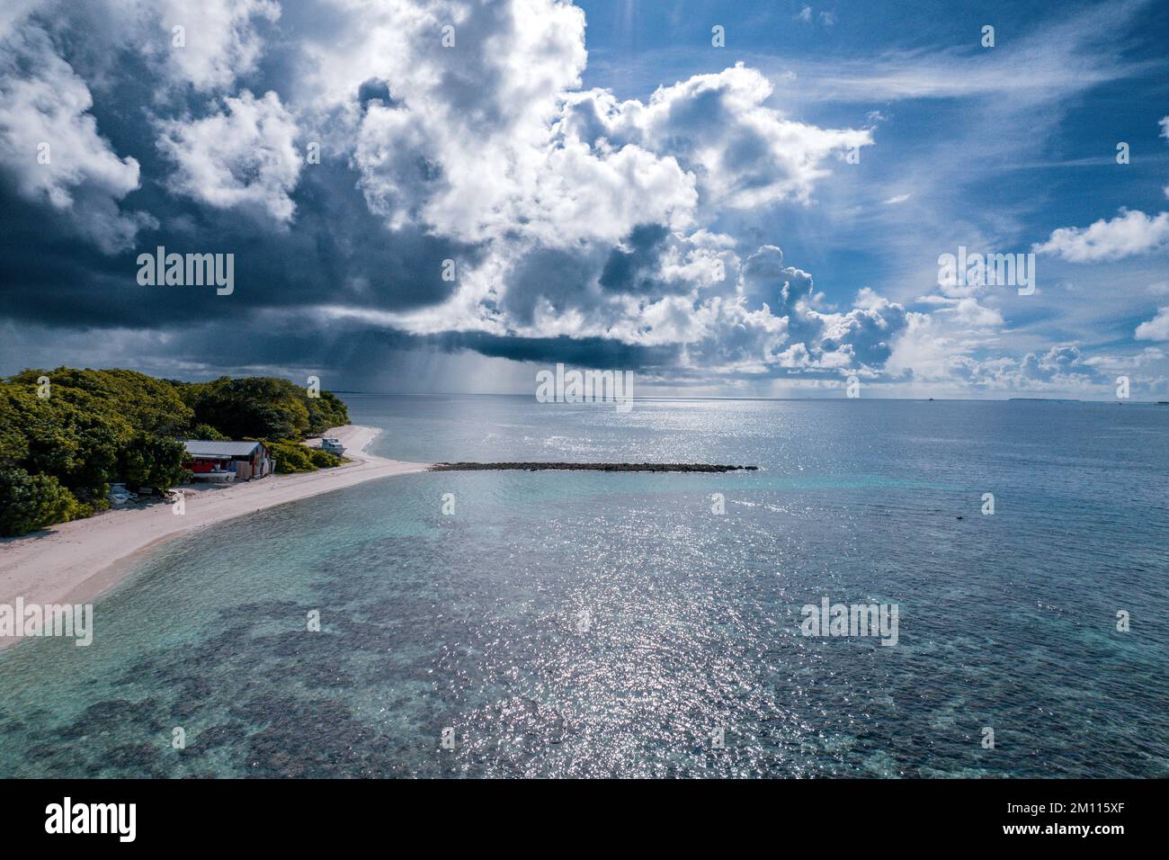 An aerial shot of the beautiful ocean and the Baa Kamadhoo beach in ...