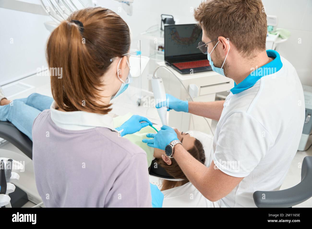 Dentist scanning patient mouth with digital intraoral scanner Stock ...