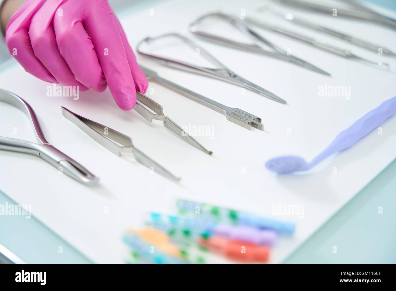 Set of special orthodontist instruments lies on the surgical table ...