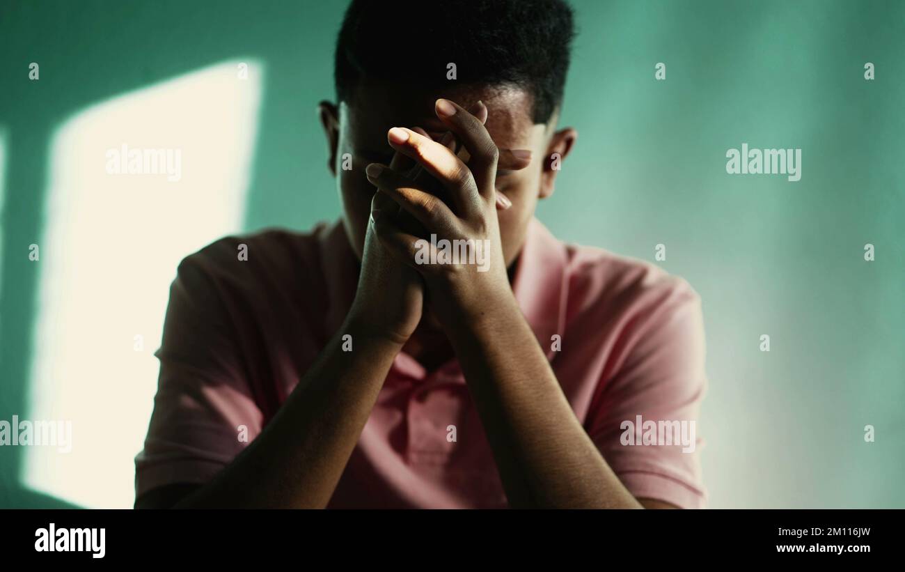 Desperate young hispanic man in despair alone at home. Depressed South ...