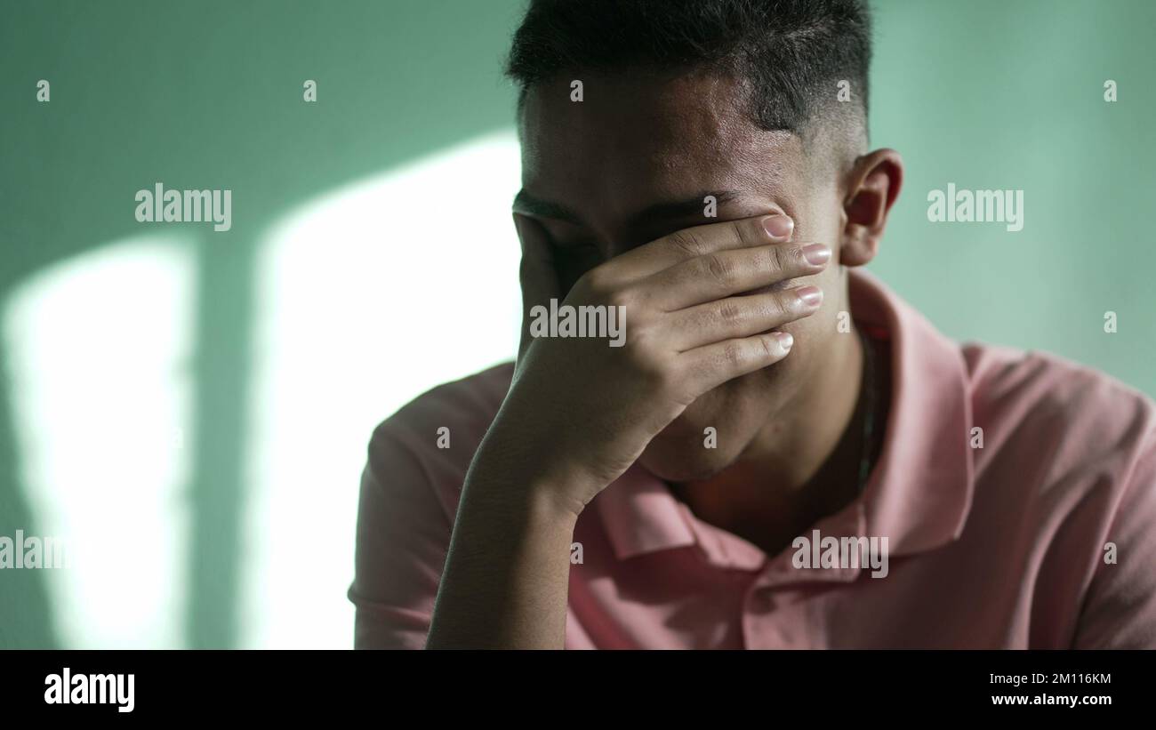 Depressed young latin man crying hi-res stock photography and images ...