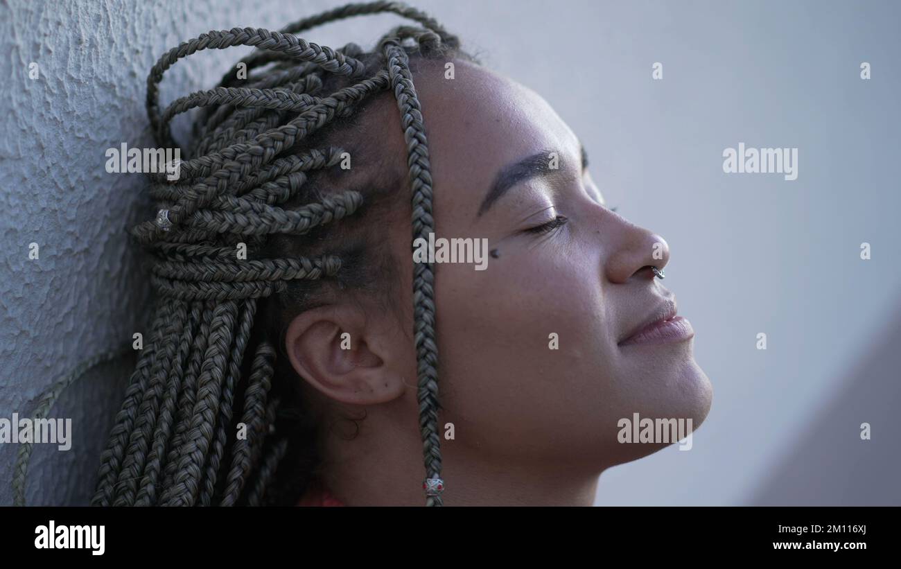 One meditative black woman closing eyes in contemplation. Female person ...